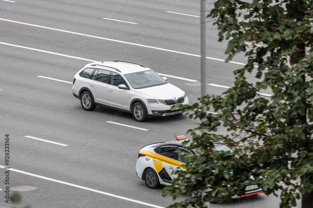 Skoda Octavia Scout Mk3 at the city road in motion. Gray car driving ...