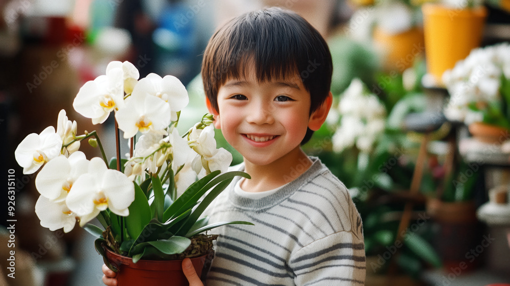 child and orchid, kid with orchid plant, orchid child, youth tending to ...