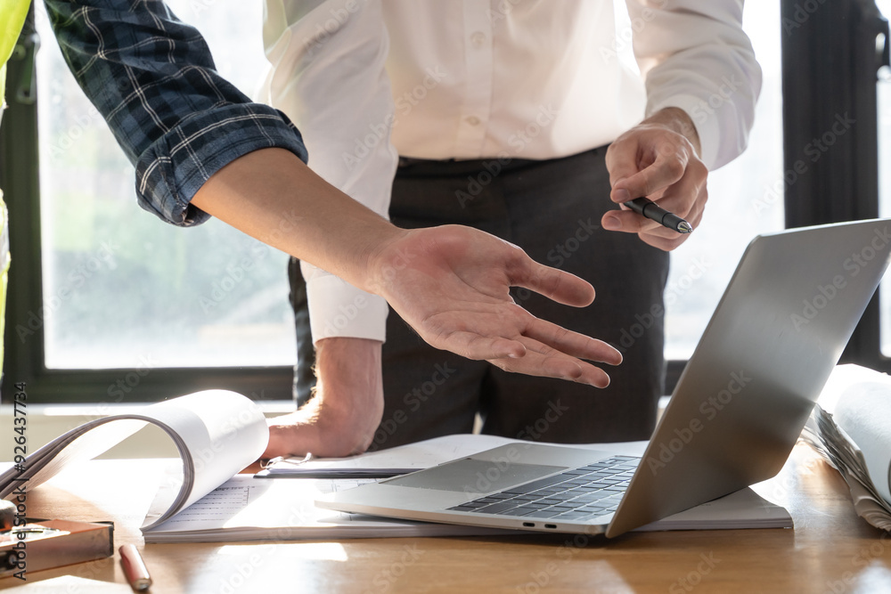 architect explaining client demand plan of construction on the table to ...