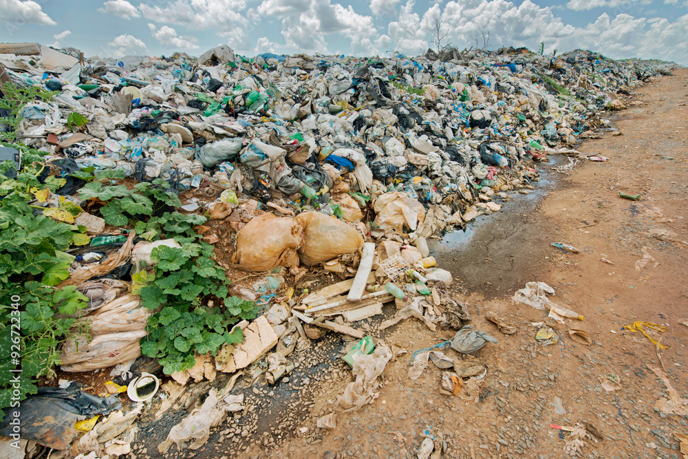 Garbage being prepared for compacting trash in sanitary landfill of the ...