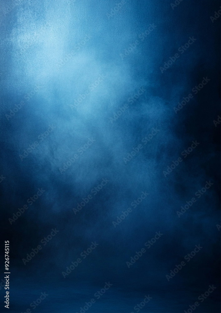 Elegant studio backdrop with a deep blue gradient and a smooth, misty ...