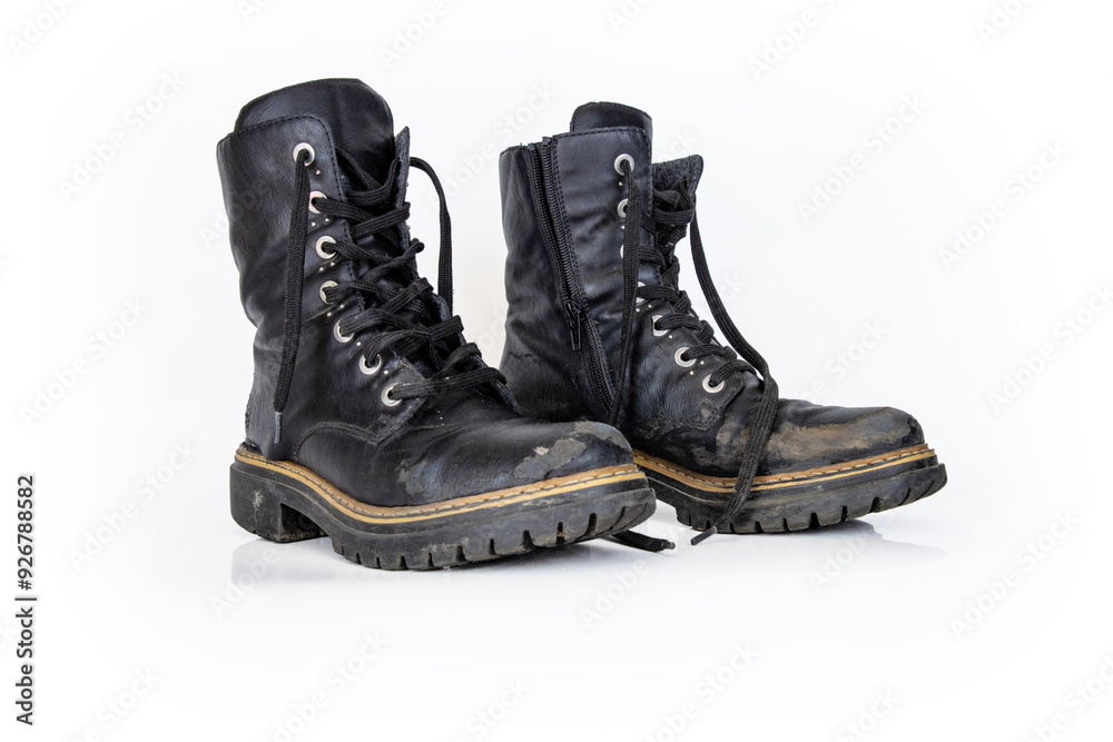 Pair of rugged worn black ankle leather combat boots with thick, sturdy ...