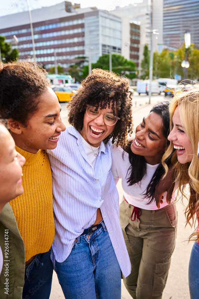 Vertical. Group multicultural young only urban women standing hugging ...