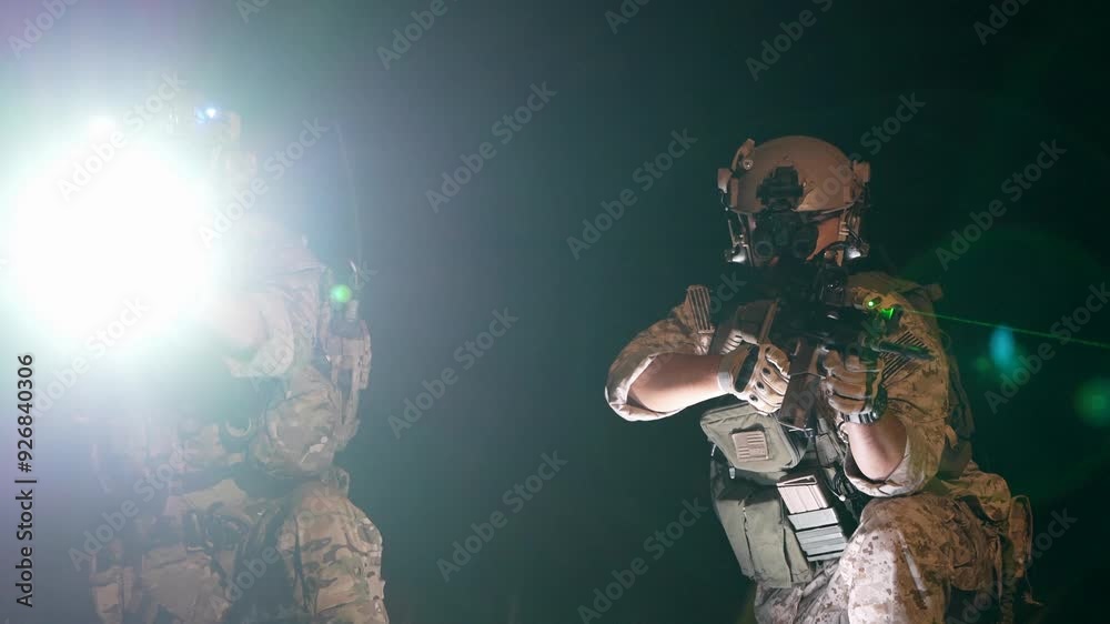 Nighttime military operations involve soldiers in full gear and armor ...