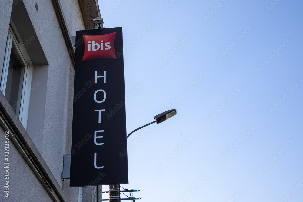Ibis hotel brand text red and sign facade logo on wall building ...