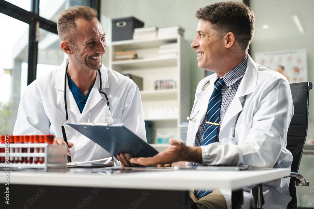 Doctor taking a blood sample tube from a rack with machines of analysis ...