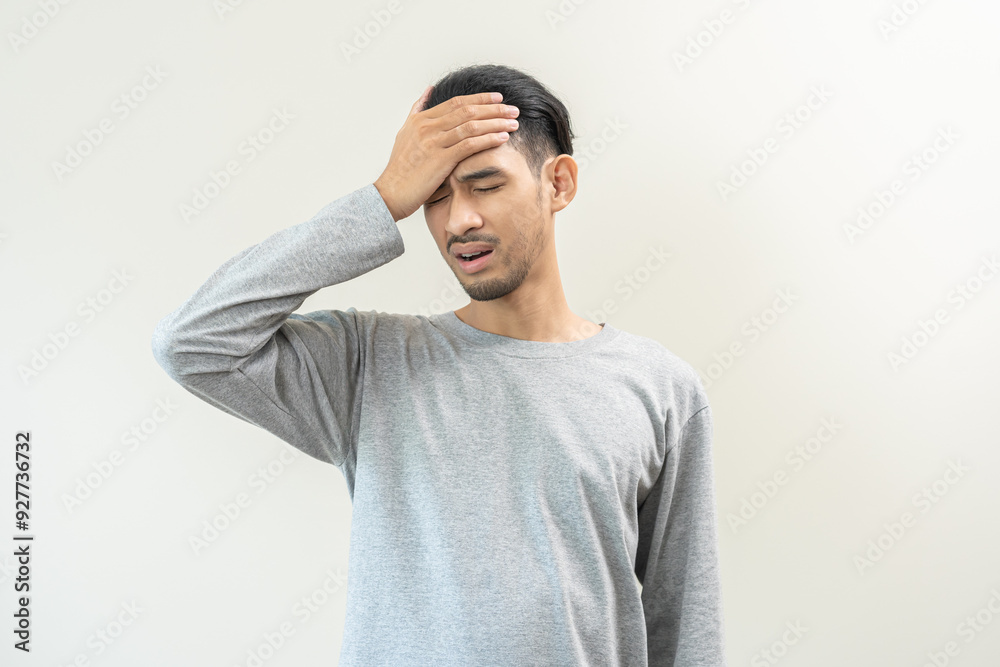 Dizzy asian young man, male headache or migraine pain suffering from ...