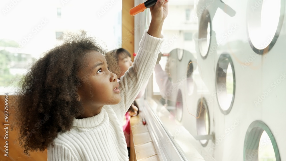 Closeup of african creative student draw beautiful picture at glass ...