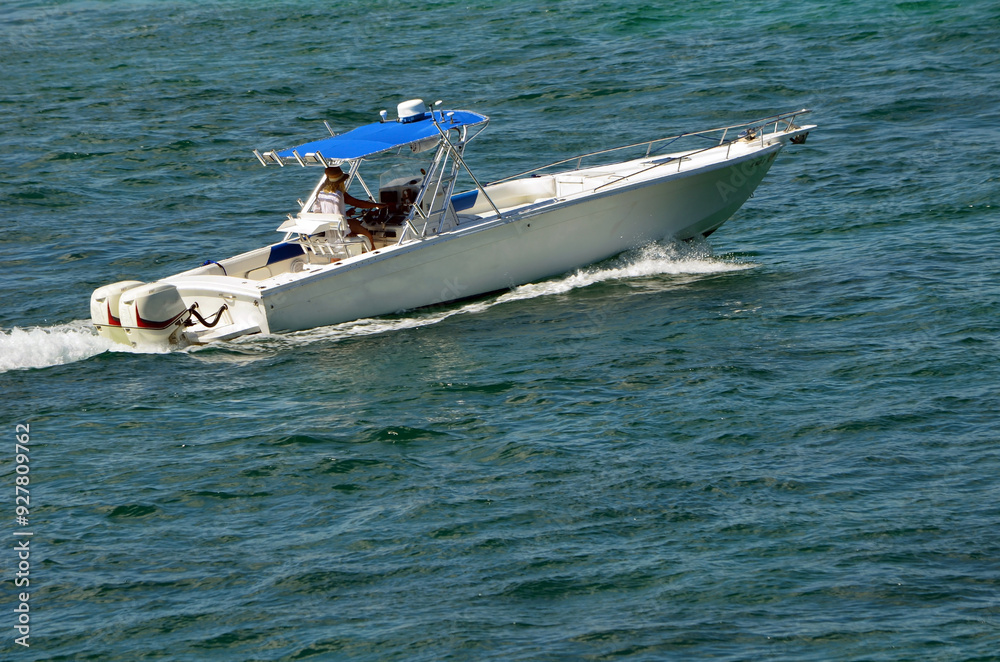Fishing boat powered by two outboard engines cruising on the Florida ...