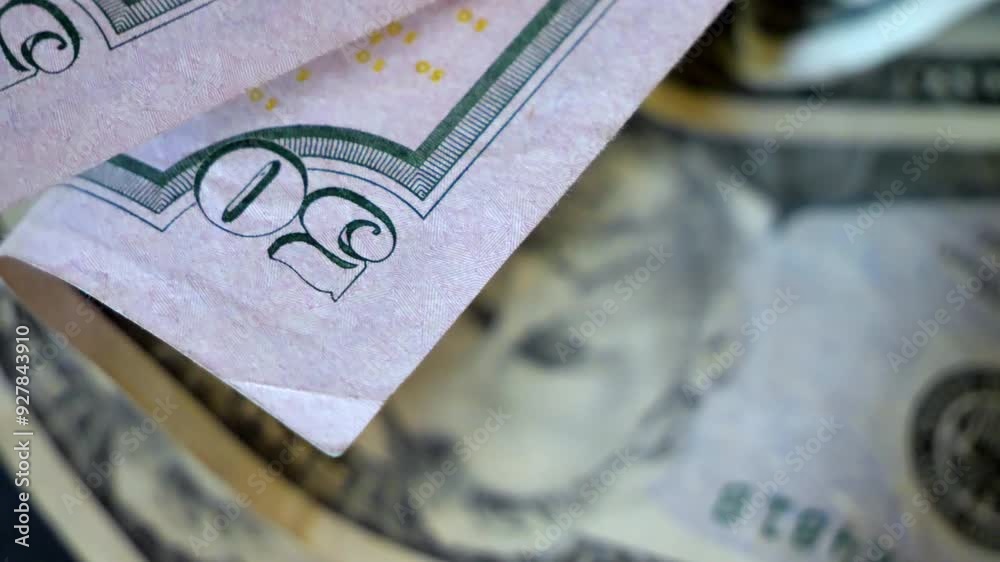 A close-up video of a US dollar bill. A fragment of a dollar bill is ...