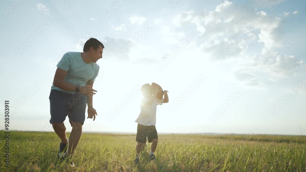 Father and son playing rugby. Family enjoying time together with rugby ...
