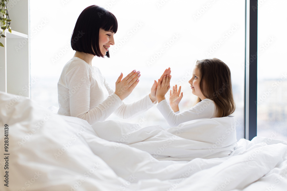 Bright, joyful morning scene of maternal love, togetherness and fun ...