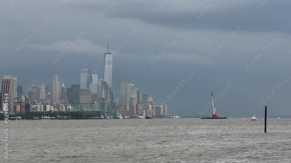 lightning striking behind nyc skyline and hudson river barge (light ...