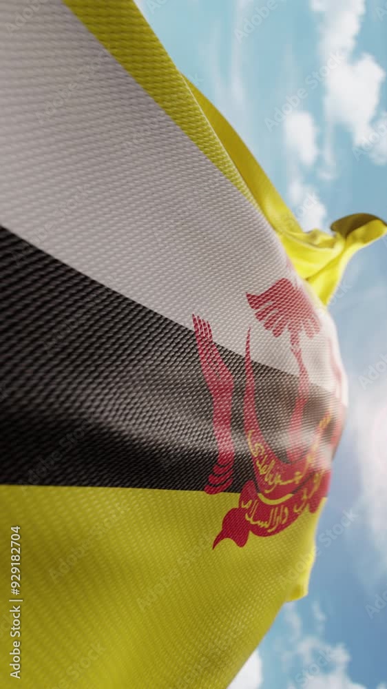 Wavy flag of Brunei blowing in the wind in slow motion. Waving colorful ...