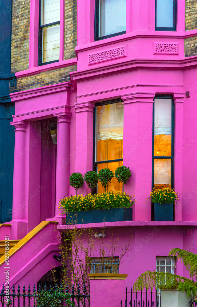 Pink facade of a typical British house with architectural details ...