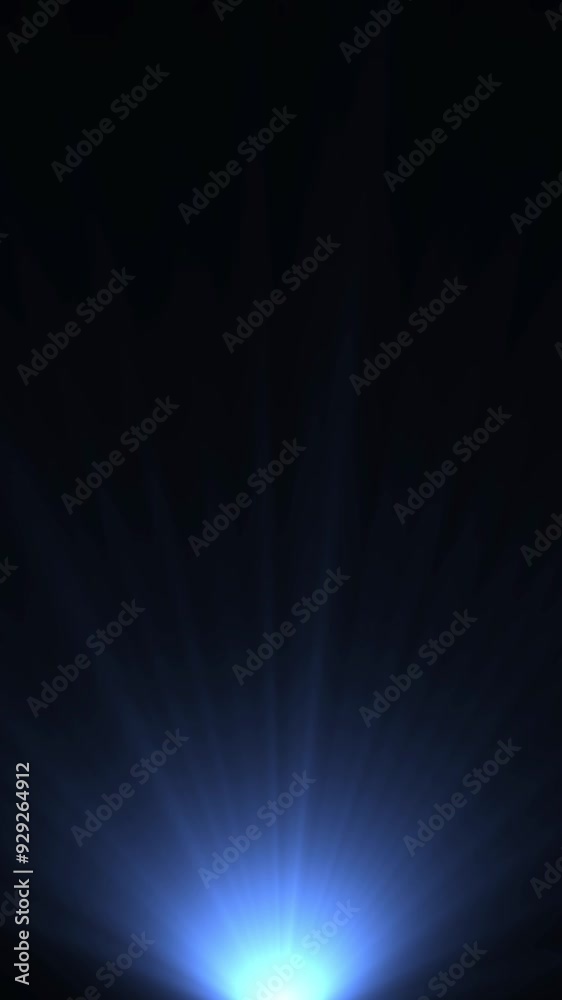 Blue volumetric shimmering light from bottom on dark background, empty ...