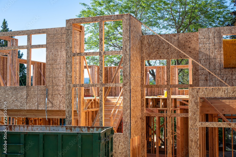 Summer construction season, two story new house build in progress at ...