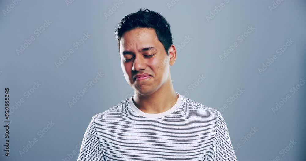 Sad, indian man and crying in studio for depression, crisis and ...
