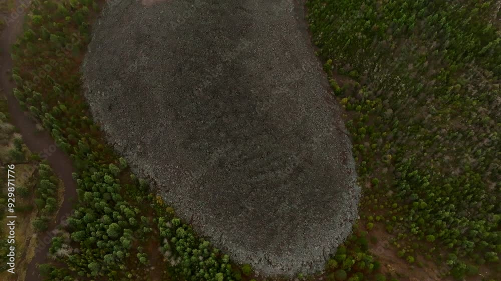 Top-down view over extinct lava flow reveals the crater rim and ...