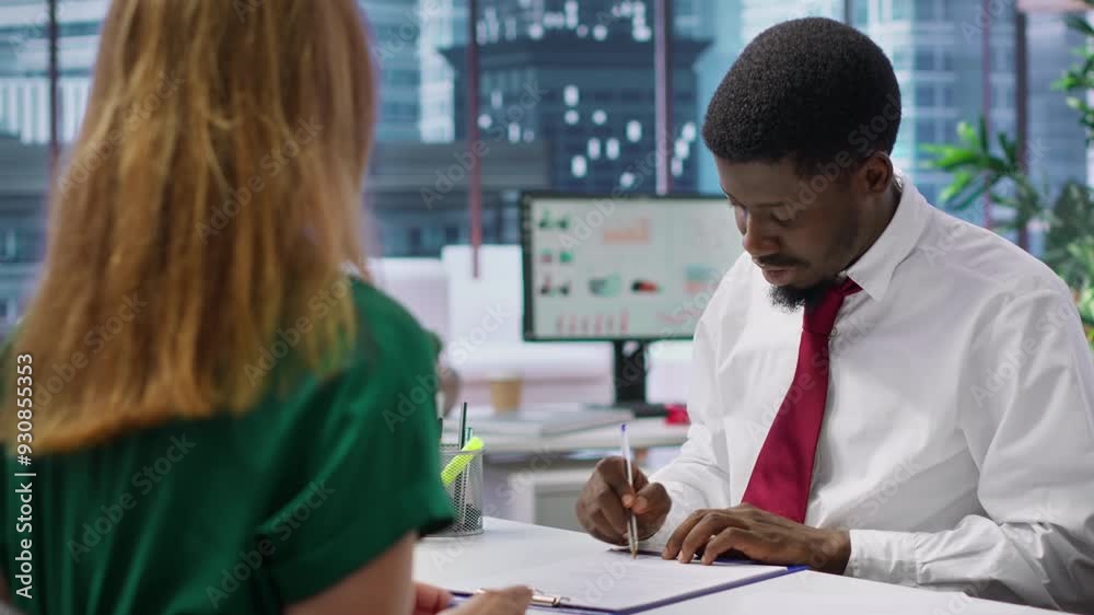 New employee signing his work contract after successful job interview ...