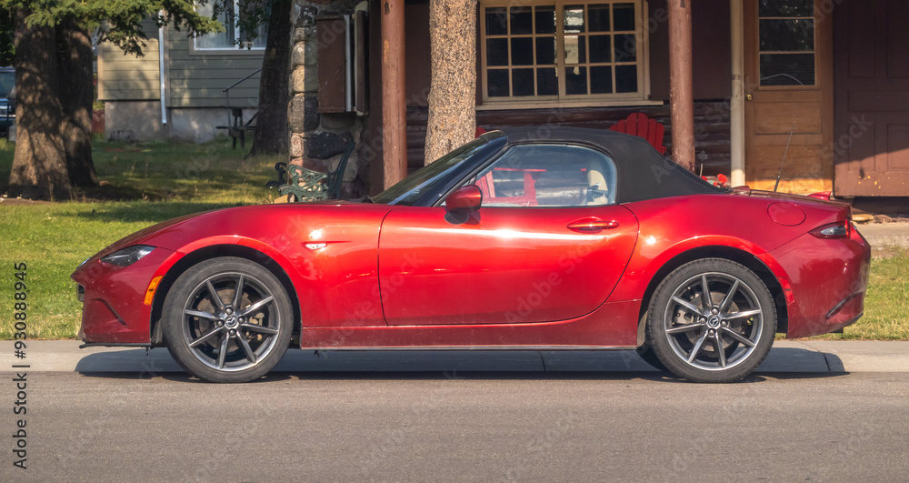 Waterton Park, AB, Canada. Aug 20, 2024. A vibrant red Mazda MX-5 Miata ...