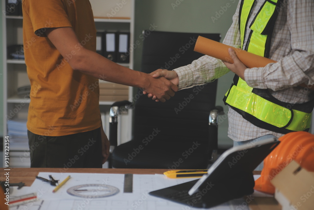 Architect men making handshake in construction site. Employee or worker ...