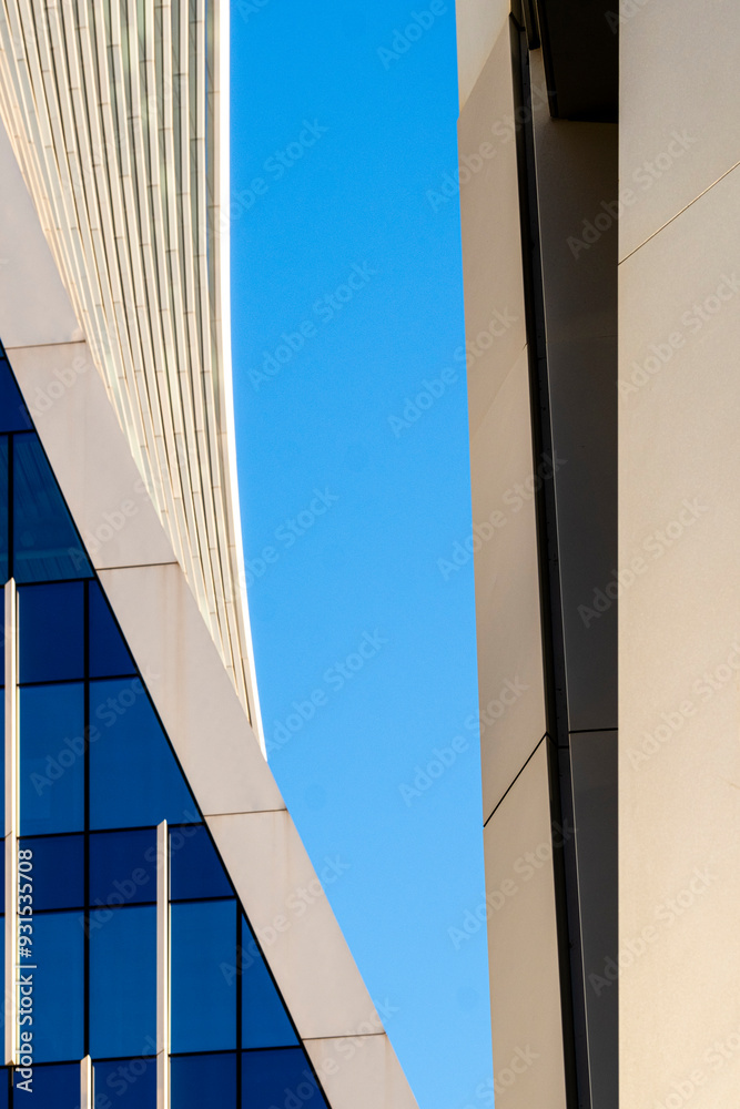 This image depicts a close-up of modern architectural structures with a ...