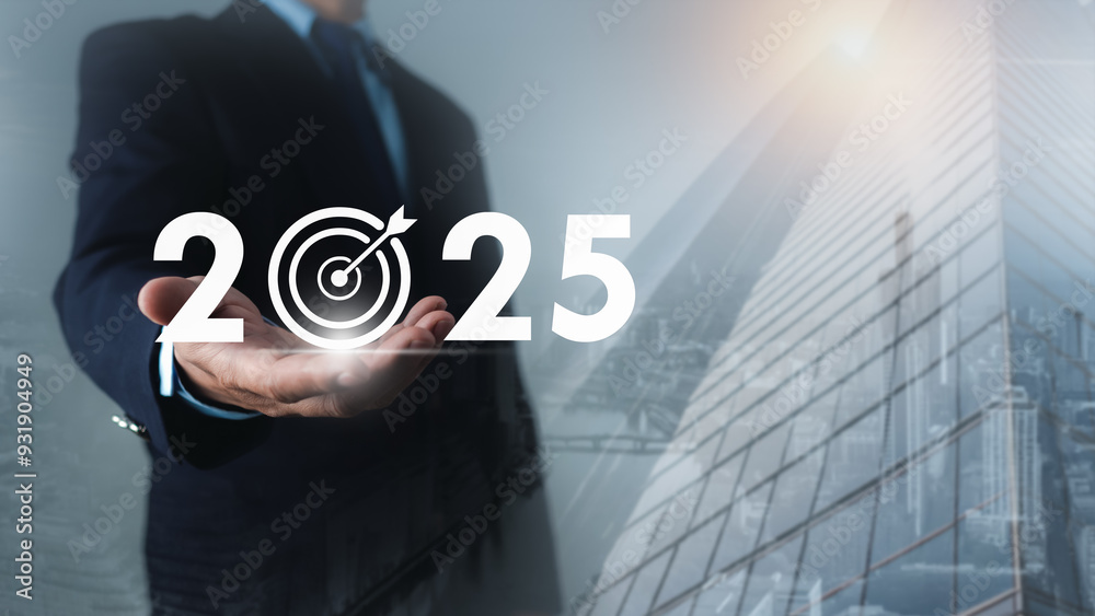 Businessman holds text 2025 with arrow target, Set goals for 2025 ...
