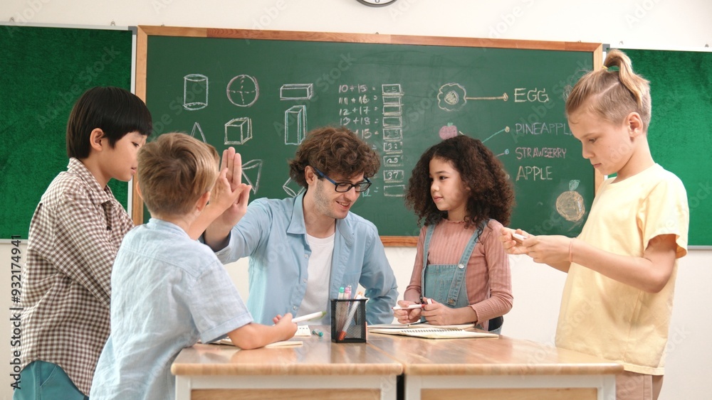 Smart teacher explain idea while diverse children drawing mind map ...