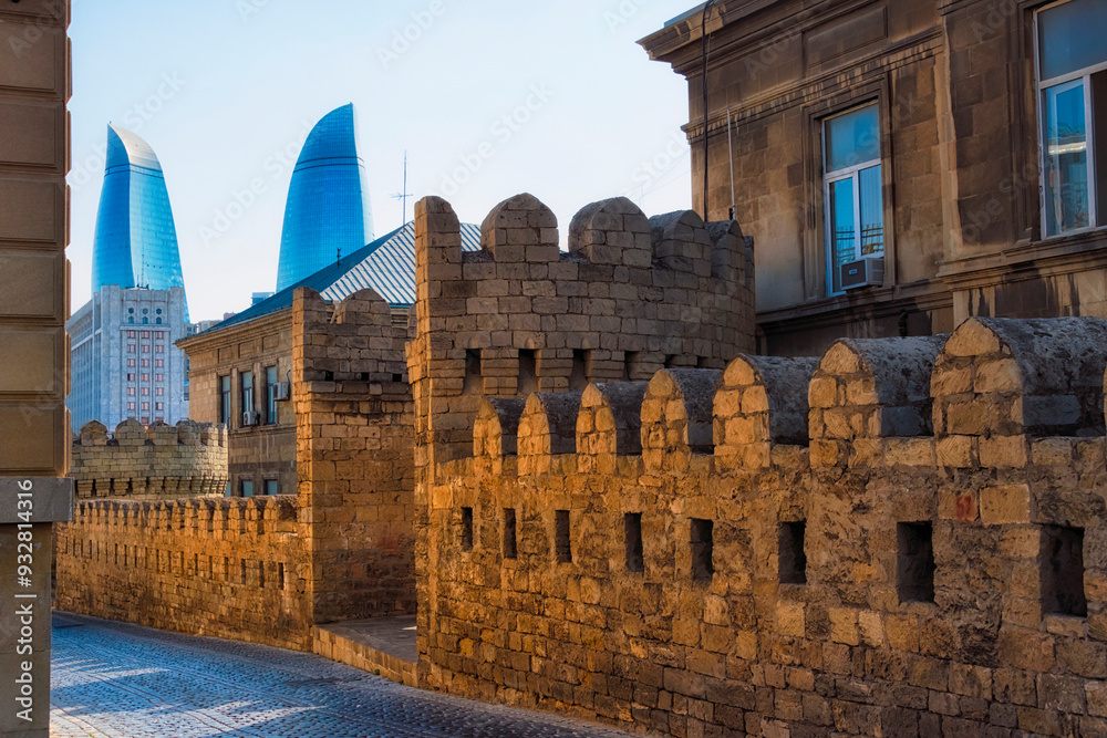 The Flame Towers with traditional houses in the Inner City of Baku ...