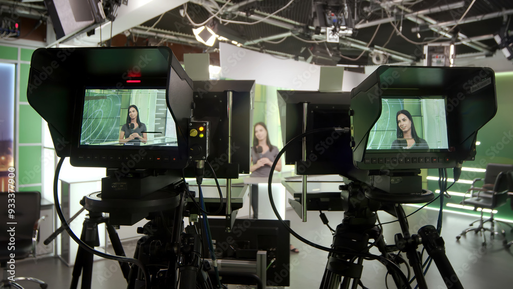 State-of-the-art cinema camera on set with lighting and crew. Capturing ...