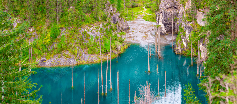 Sunken forest of Lake Kaindy in Kazakhstan. Beautiful mountain natural ...