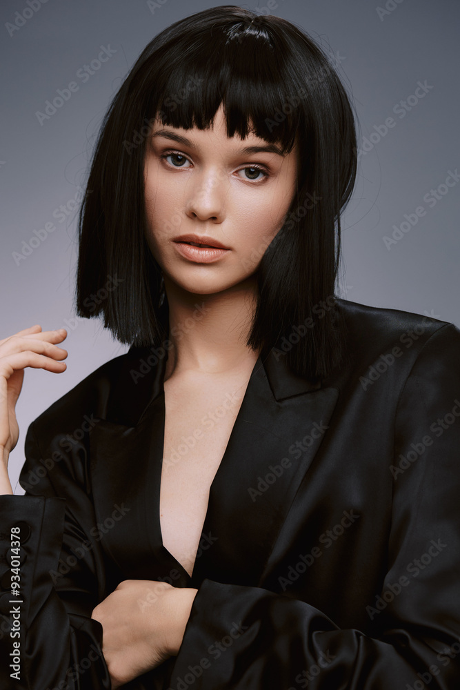 Woman, black suit, short bob hairstyle a woman in a sleek black suit ...