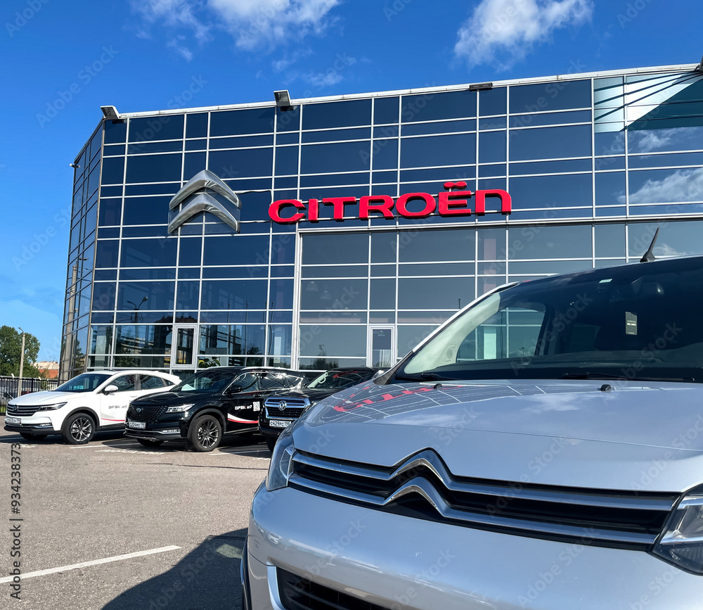 Citroen sign on glass facade of dealership building. Citroen logo and ...