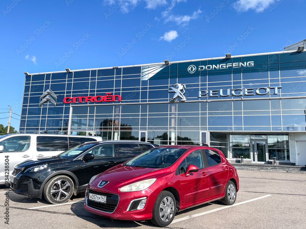 Citroen sign on glass facade of dealership building. Citroen logo and ...