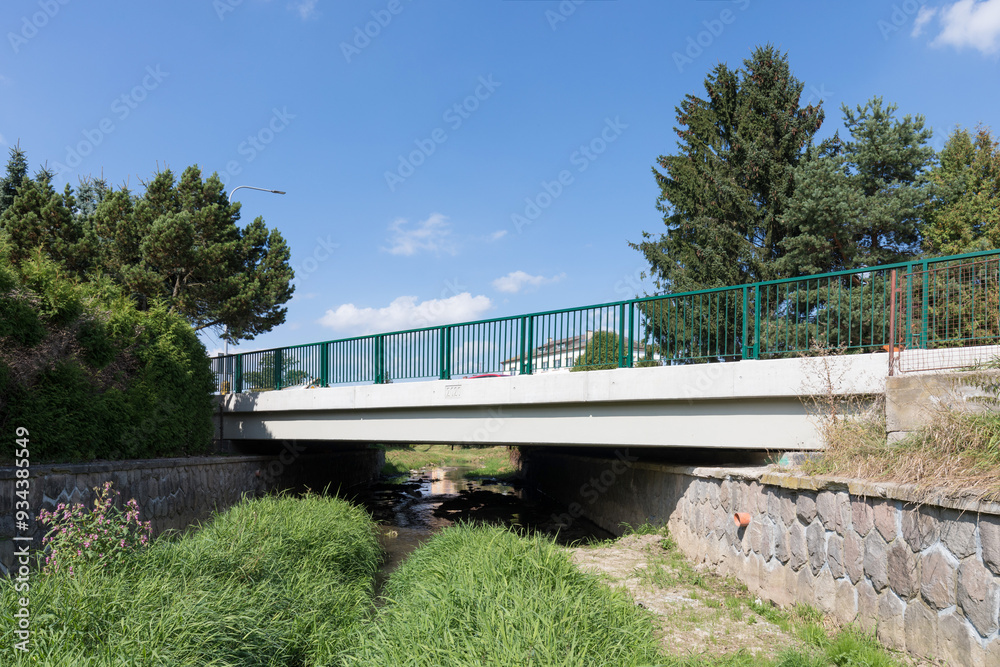 Reinforced concrete road bridge over the river. Close-up during sunny ...