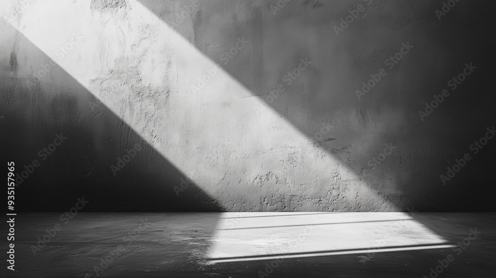 In a dimly lit room, a bright beam of light pierces through ...