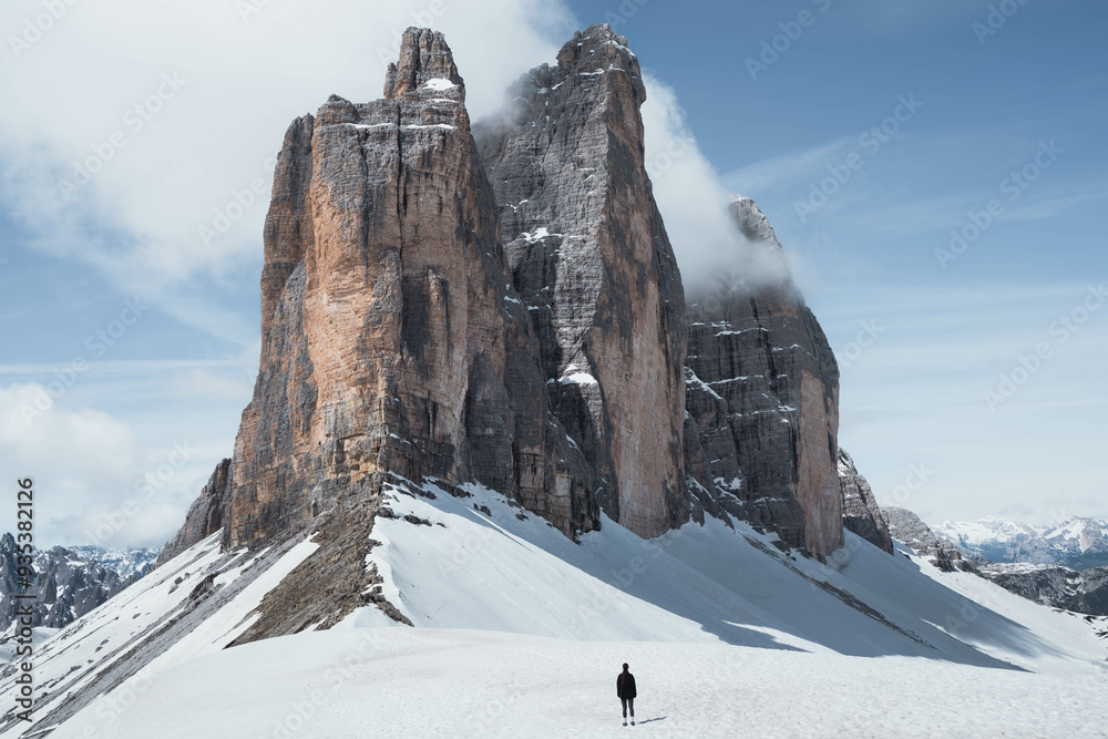 Girl standing in fronnt of a huge mountain in the Italian Alps, The ...