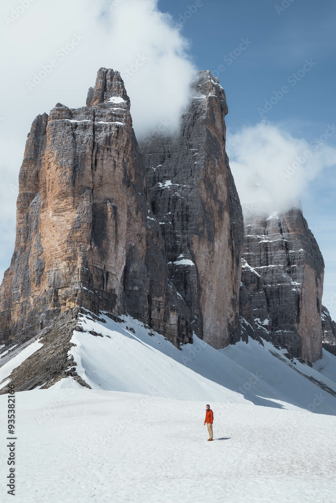 Girl standing in fronnt of a huge mountain in the Italian Alps, The ...