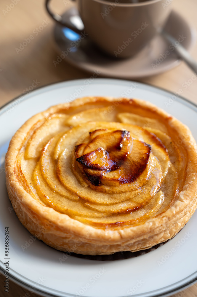 French fresh baked sweet puff pastry with fresh apple fruits in sirup ...
