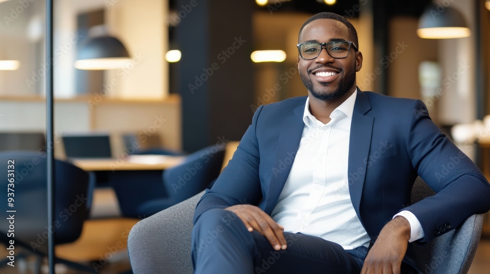 Smiling candidate sitting confidently in a modern office, dressed in ...