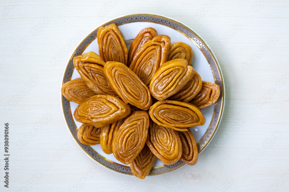 Delicious gaja (also known as khaja, chiroti, or chirote) in a white ...