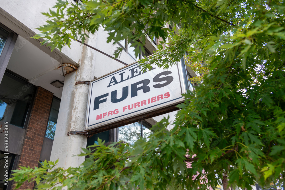 old projecting sign above or near entrance to Alex Furs located on ...