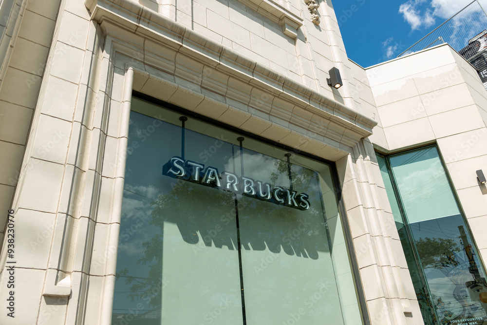 Starbucks sign inside display window at historic building, 440 College ...