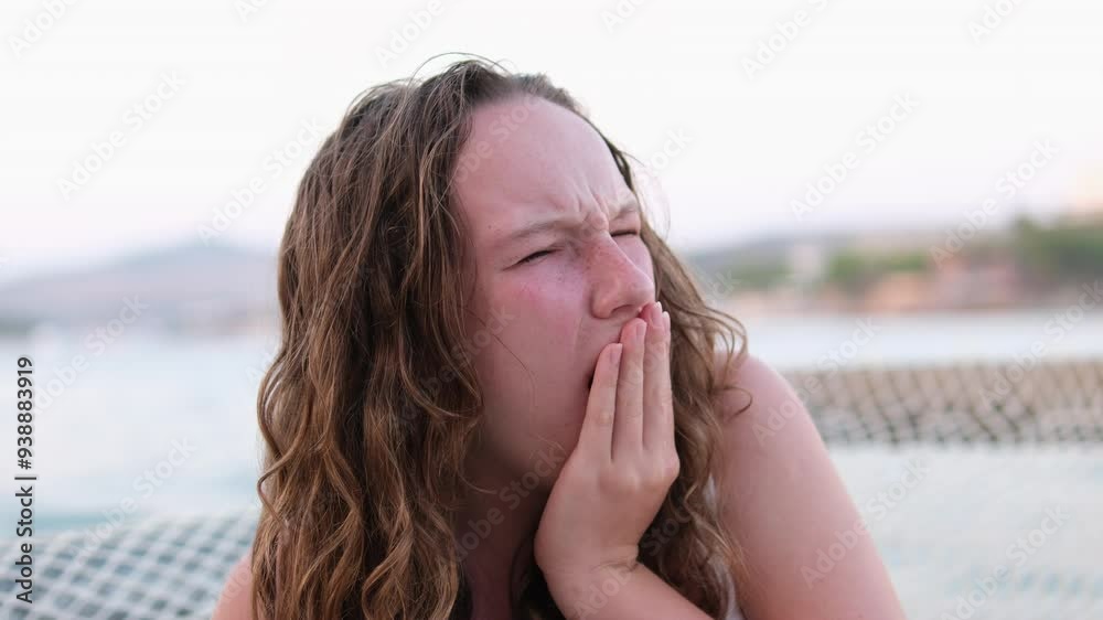 girl yawning on the beach Relaxing on beach emotions of young girl ...