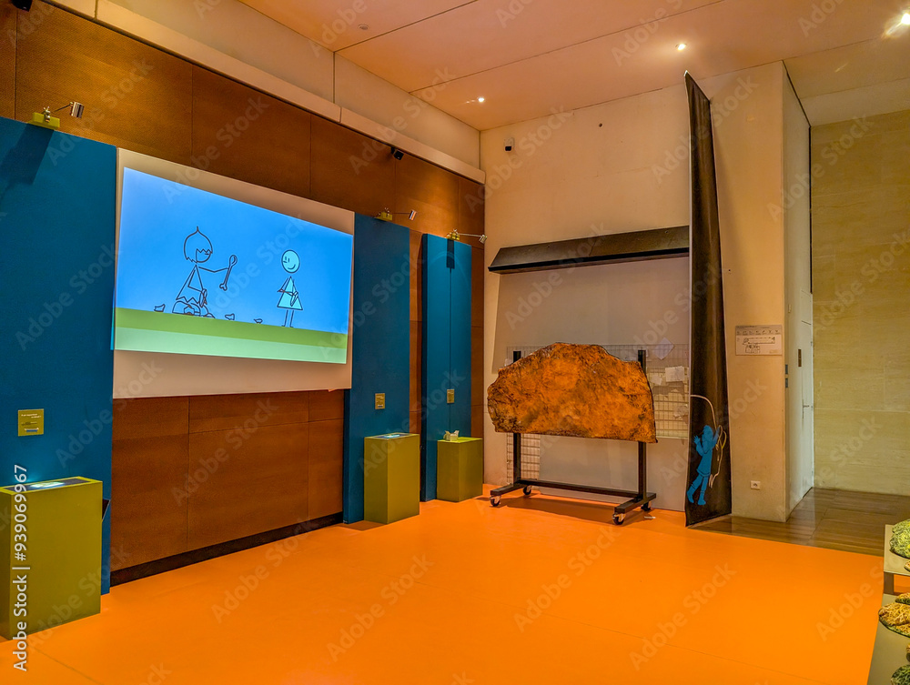 France, 7 July 2024: Interactive museum exhibit with a large tree cross ...