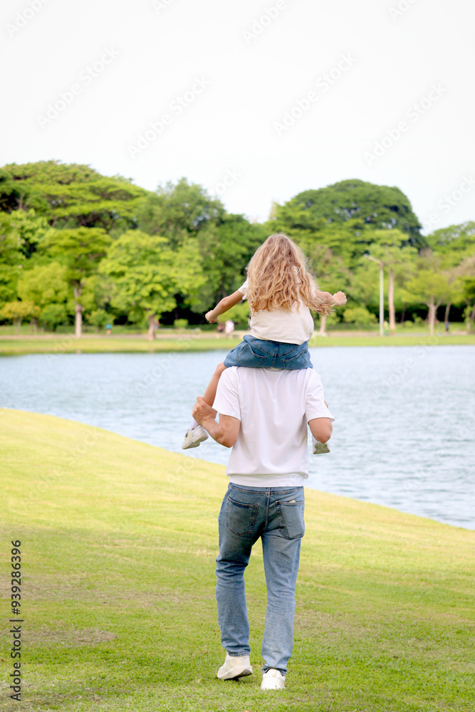 Back of father carrying cute daughter, joyful parent piggybacking his ...