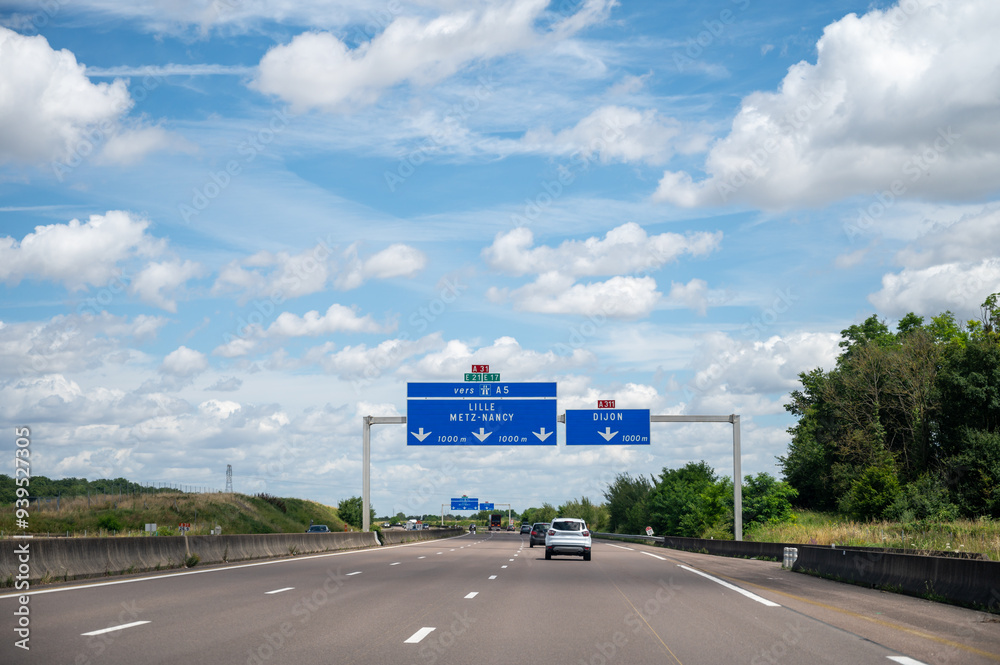 Driving in summer on road, road signs direction to Lille, Nancy and ...