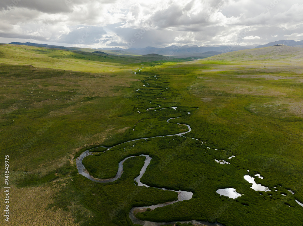 Aerial view of a water stream winding down the second highest plateau ...