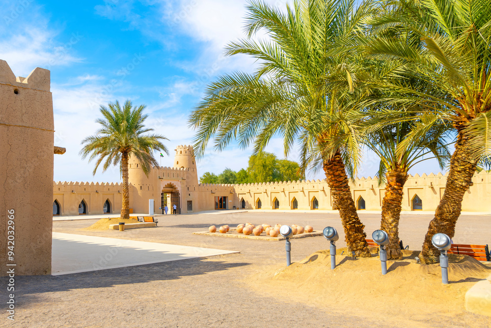 Palm trees inside defensive walls and courtyard of the historic Al ...